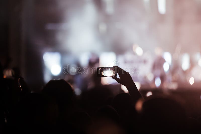 Cheering Crowd at Concert Enjoying Music Performance Stock Image ...