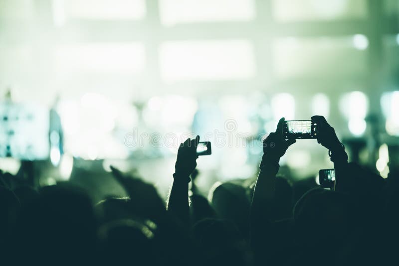Cheering Crowd at Concert Enjoying Music Performance Stock Image ...