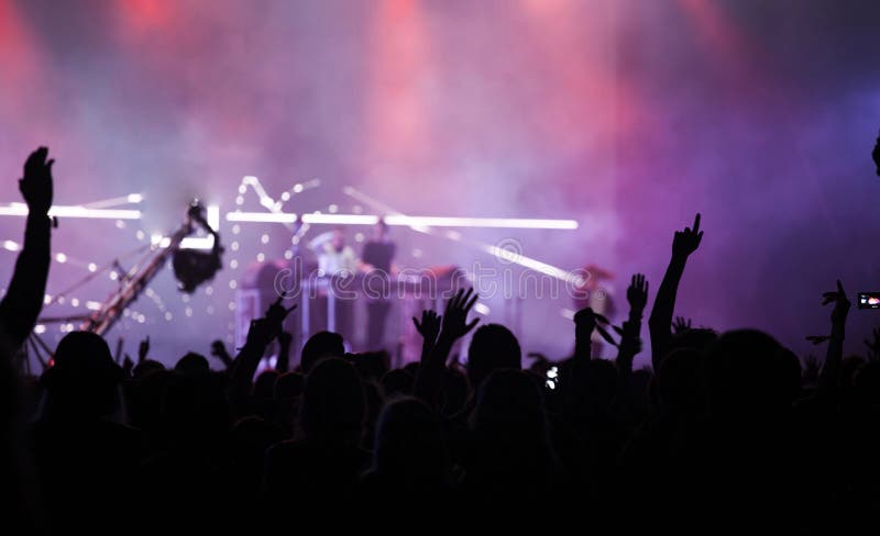 Cheering Crowd in Front of Stage Lights Stock Photo - Image of ...