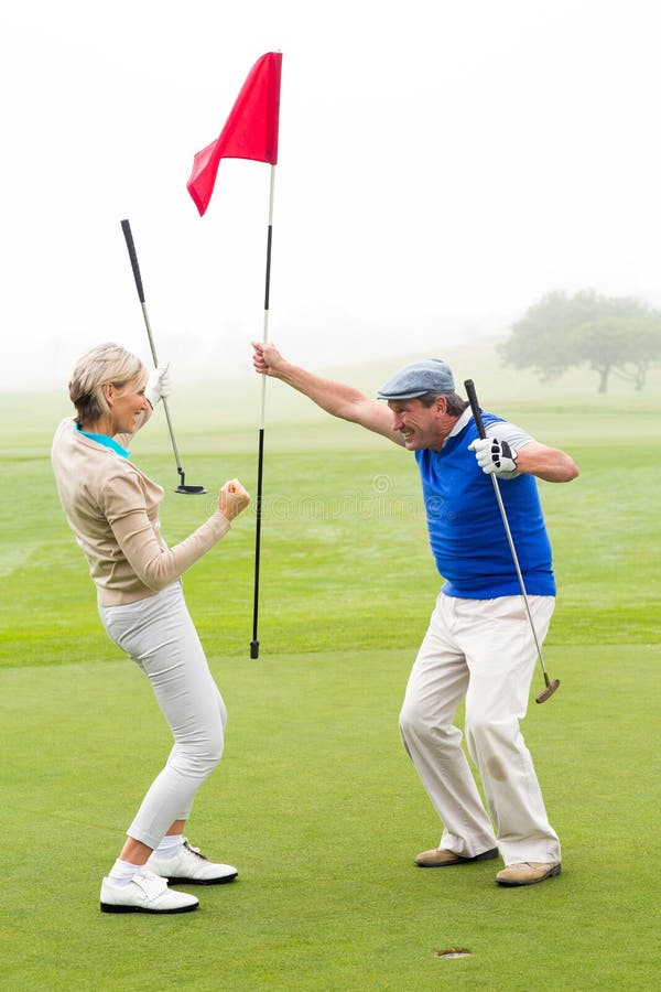 Cheering golfing couple stock image. Image of adult, lifestyle - 50485489