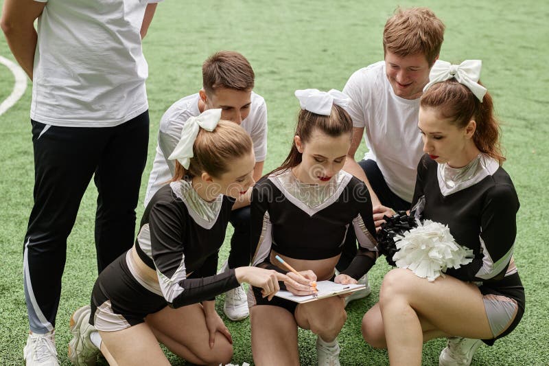 Cheerleader Team Planning Performance Together Stock Image - Image of ...