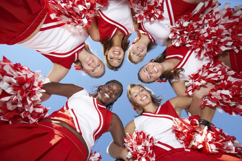Cheerleaders Forming a Huddle Stock Photo - Image of outdoors, ethnic ...