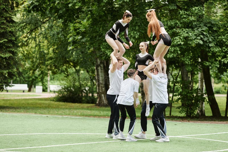 Cheerleading Team Doing Tricks at Performance Stock Photo - Image of ...