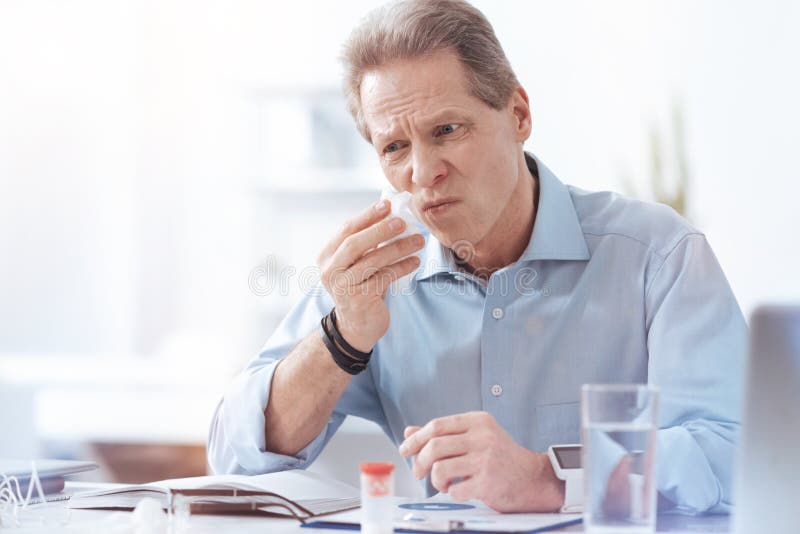Cheerless Thoughtful Man Using a Paper Tissue Stock Image - Image of ...