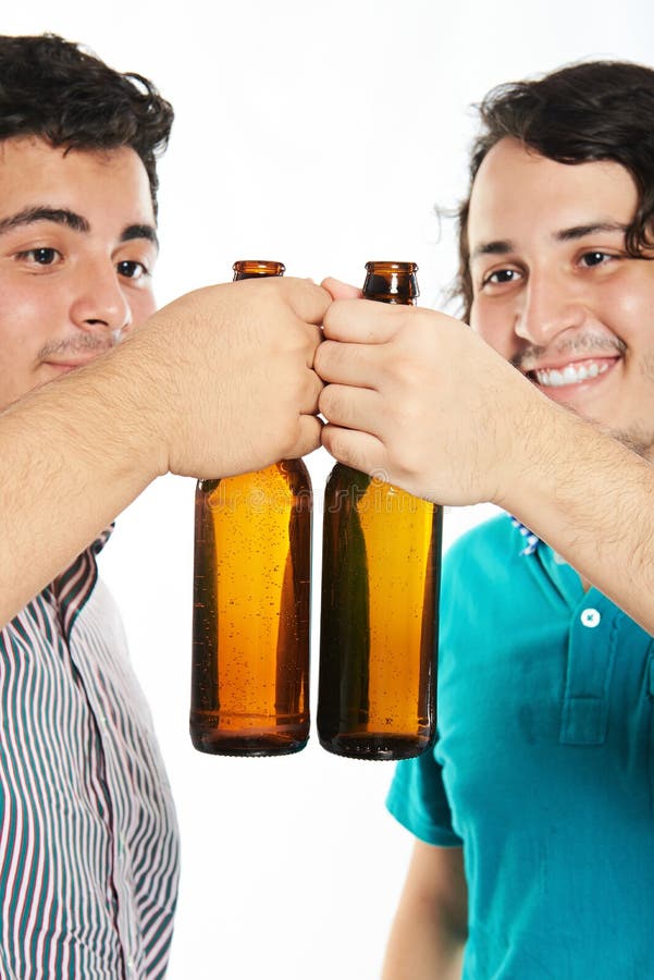 Cheersing two young man stock photo. Image of holding - 73650876