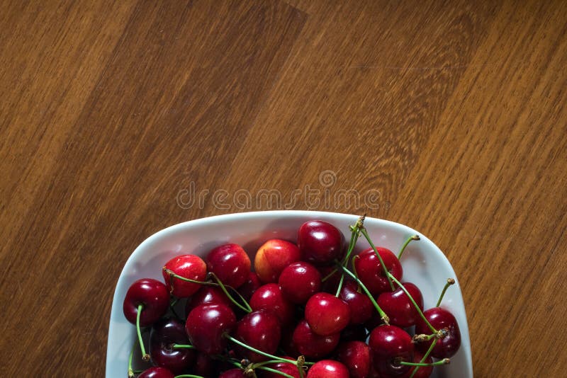 Cheery in the Plate on the Wooden Table Stock Image - Image of tasty ...