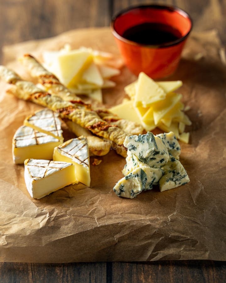 Cheese Board, Bread Sticks and Sauce on Wooden Rustic Background Stock ...