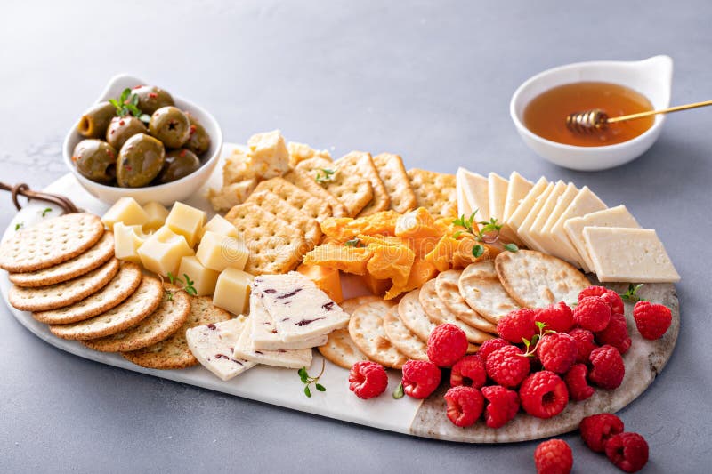 Cheese Board or Snack Board with Crackers, Cheese, Olives and Berries ...
