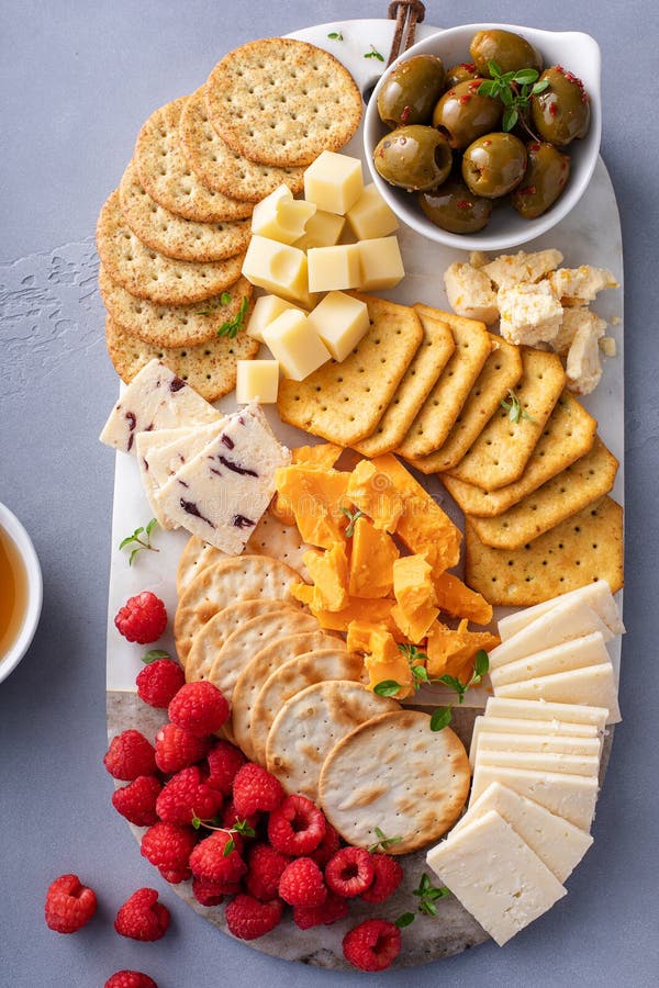 Cheese Board or Snack Board with Crackers, Cheese, Olives and Berries ...