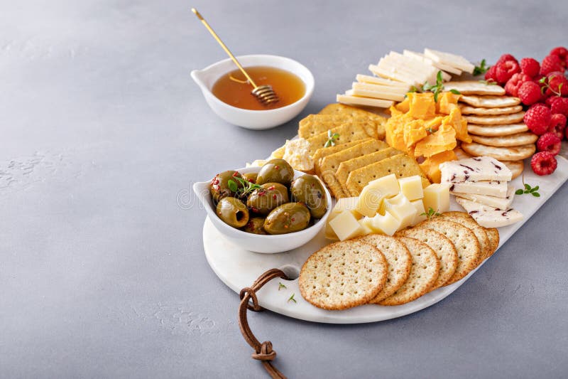 Cheese Board or Snack Board with Crackers, Cheese, Olives and Berries ...