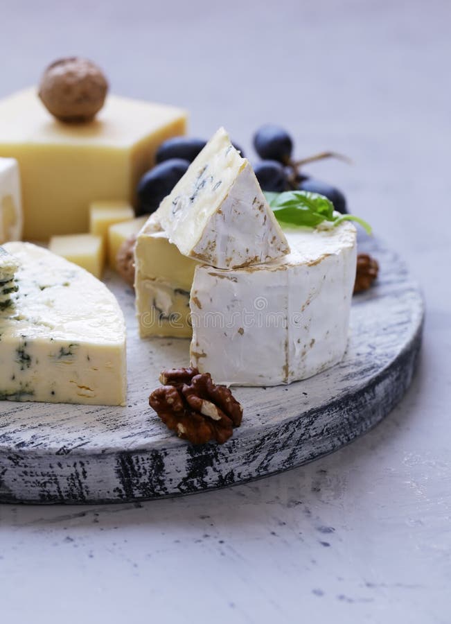 Cheese board soft cheese stock image. Image of types - 131840507