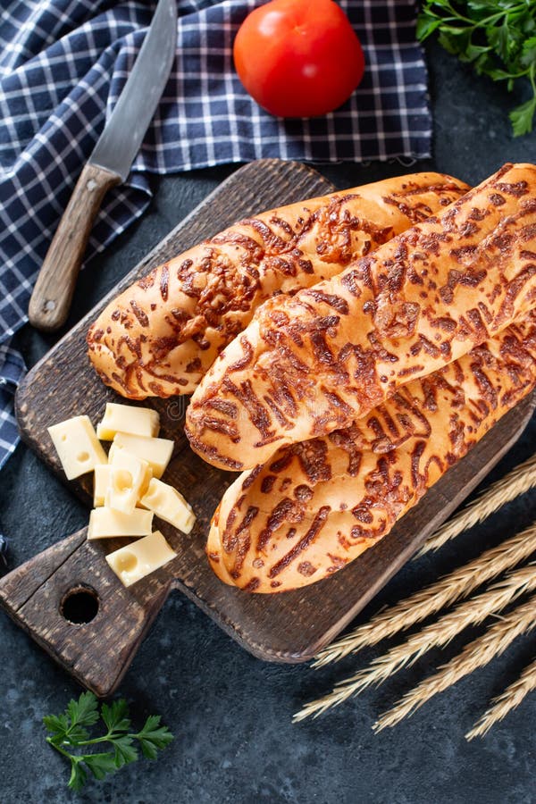 Cheese Bread. Homemade Cheesy Breadsticks on a Dark Background Stock ...