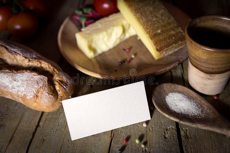 Cheese, Bread, Salt and Vegetables on a Wooden Table, Card with Stock ...
