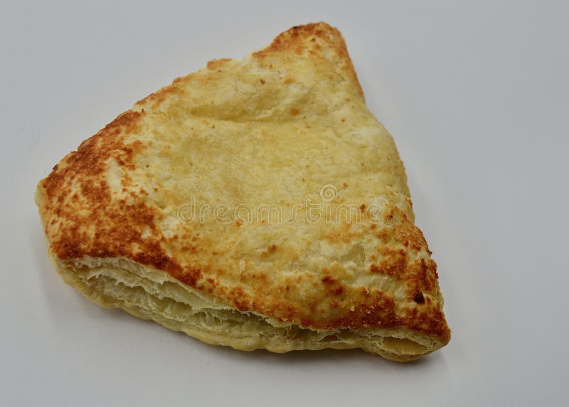 A Cheese and Chive Pastry Triangle on a Plate Stock Photo - Image of ...