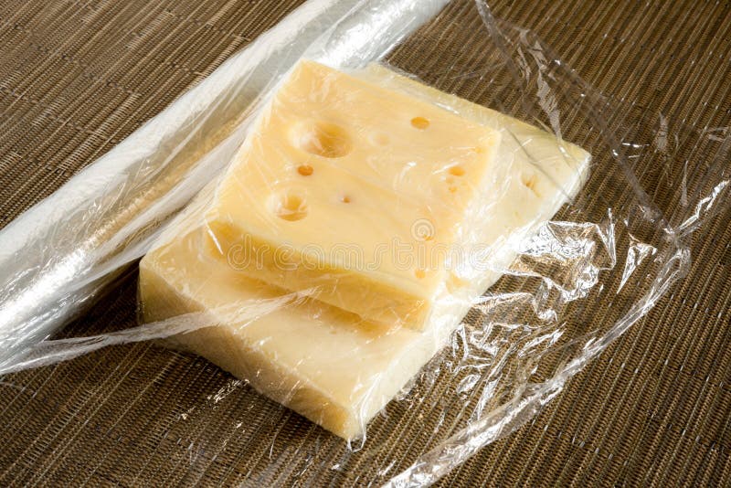 Cheese coated with plastic stock image. Image of coated - 141311107