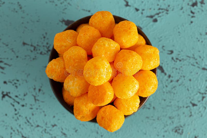 Cheese Covered Balls on a Teal Table Stock Photo - Image of golden ...