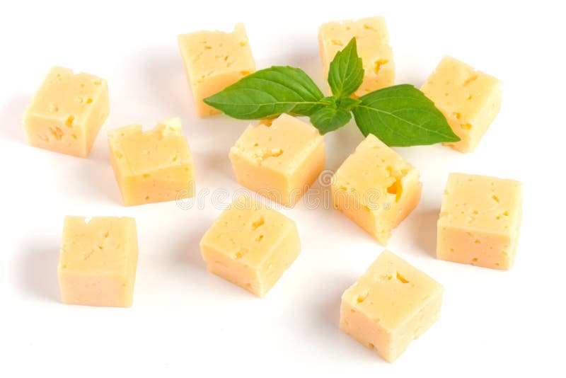 Cheese Cut into Cubes with Basil Leaves Isolated on White Background ...