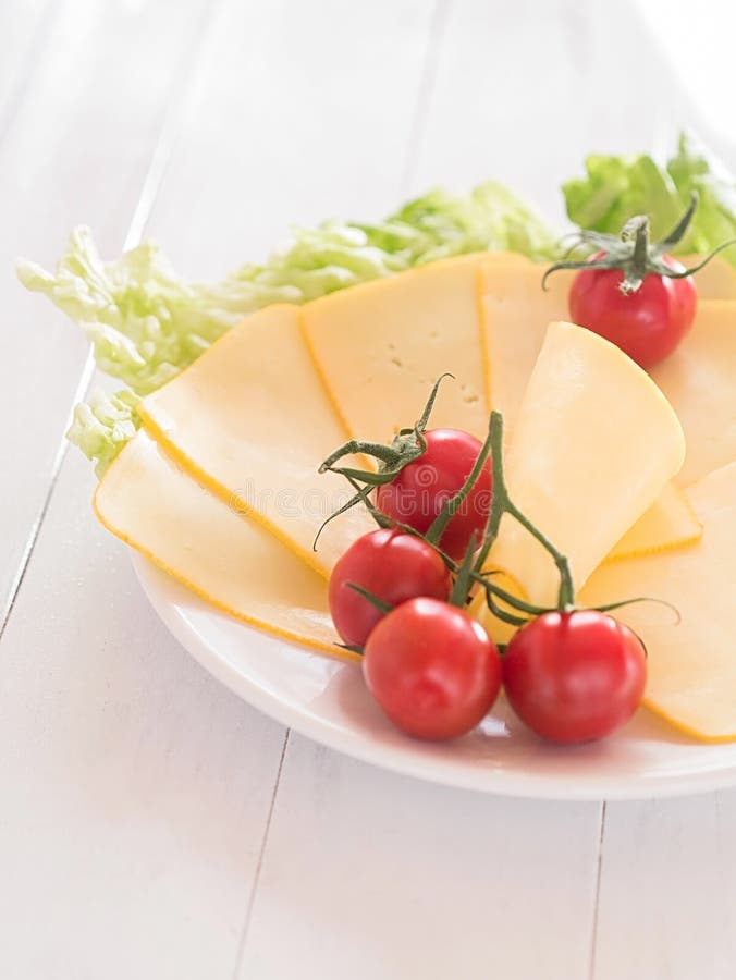 Cheese in Discs Cut on a Plate Stock Photo - Image of gouda, edam: 52629944