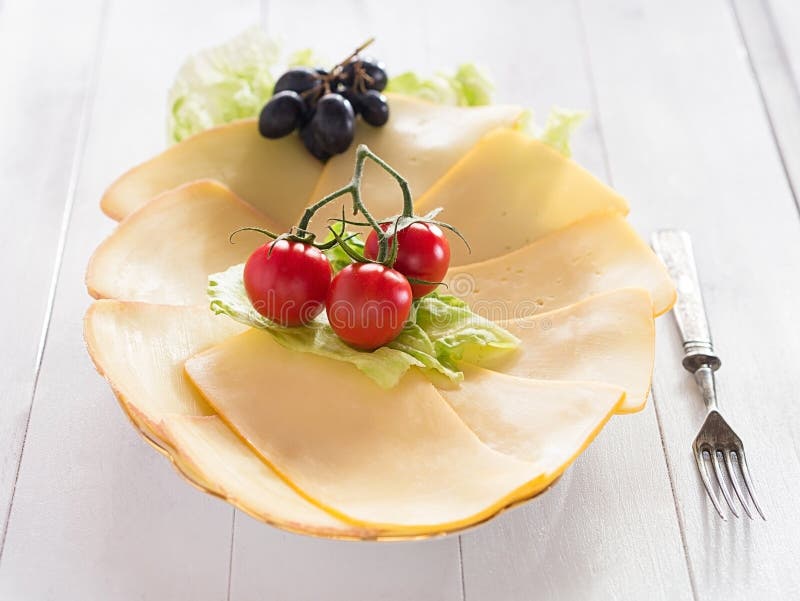 Cheese in Discs Cut on a Plate Stock Image - Image of sheet, healthy ...