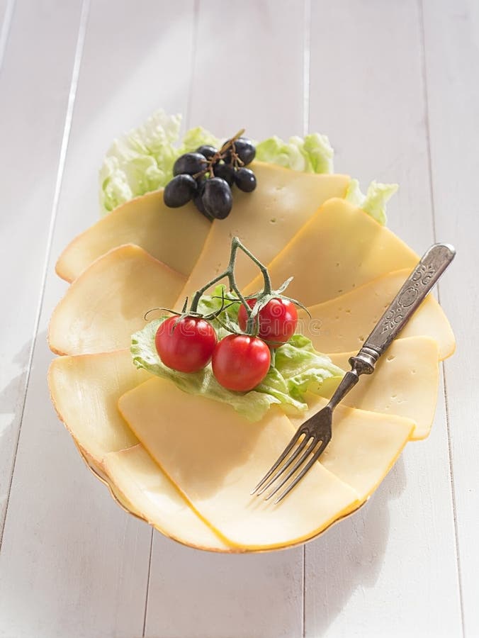 Cheese in Discs Cut on a Plate Stock Image - Image of highly, yellow ...