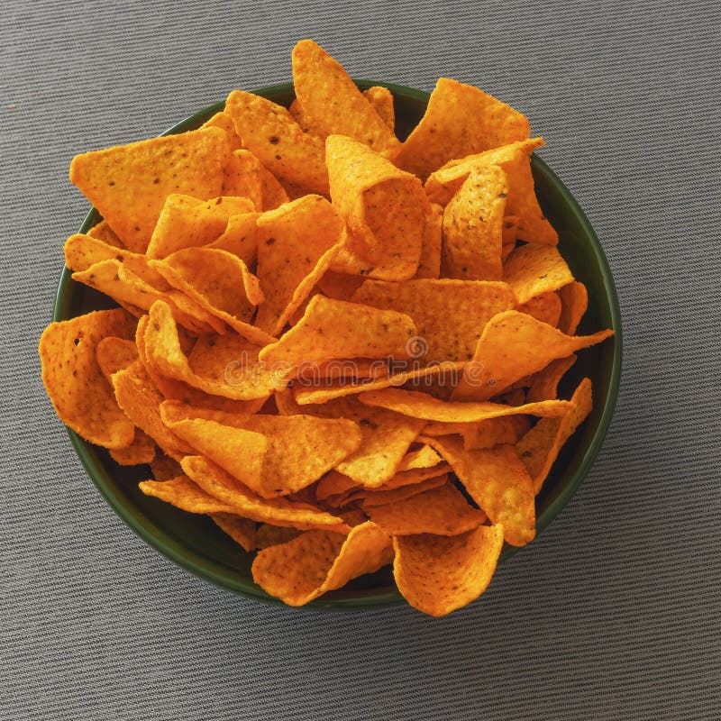 Cheese Flavored Corn Chips in a Green Bowl on a Tablecloth Stock Photo ...