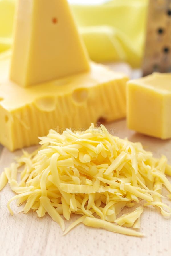 Block and Grated Cheddar Cheese Stock Photo - Image of shred, crumbling ...