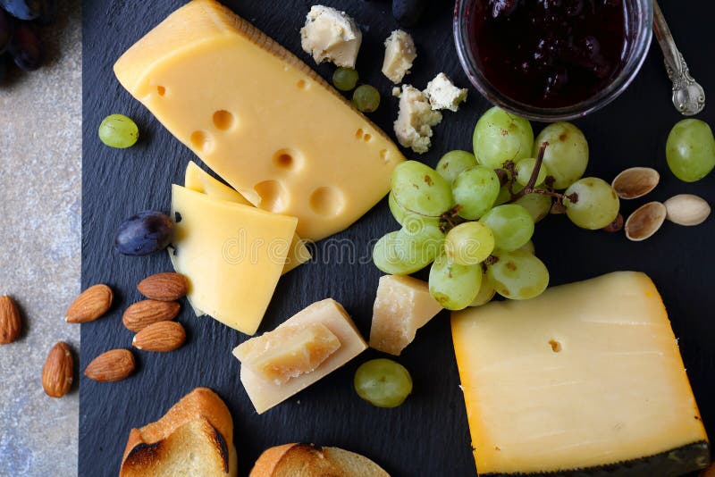 Cheese with grapes stock photo. Image of healthy, yellow - 64755372