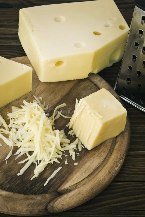 Cheese and grater close-up stock photo. Image of close - 56860212