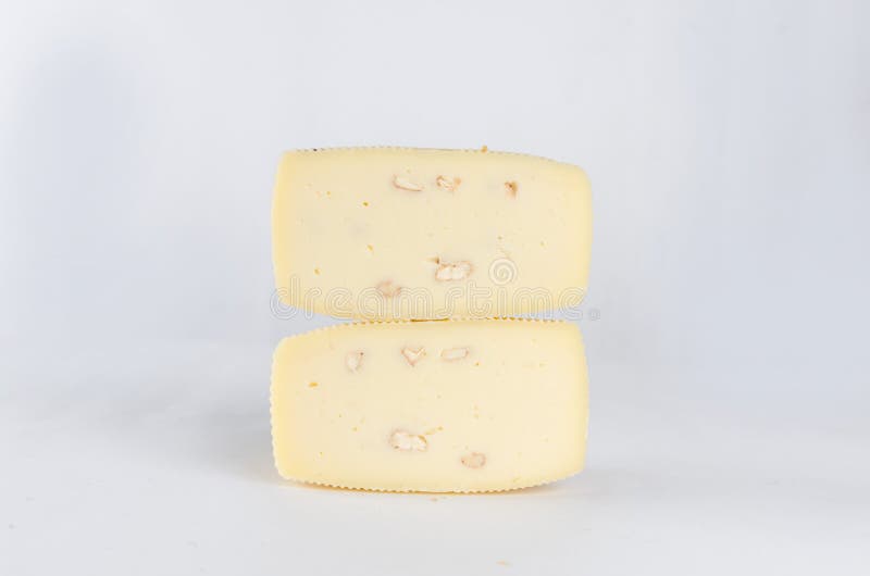 Cheese Heads of Different Kinds Stacked on Table Stock Image - Image of ...