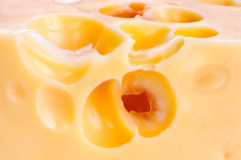 Cheese with holes stock image. Image of gourmet, piece - 28827421