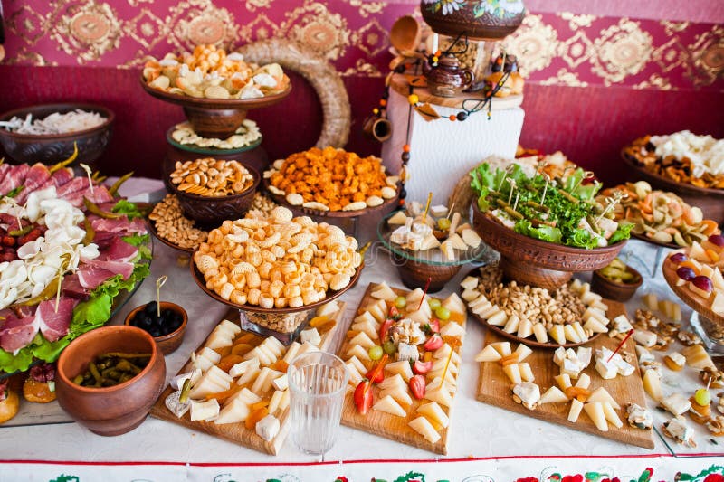 Cheese and Meat Decorated Dishes on the Wedding Banquet. Stock Photo ...