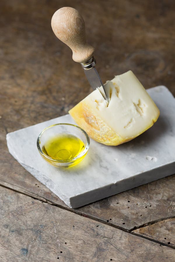 Cheese and Oil on Rustic Background Stock Image - Image of delicatessen ...