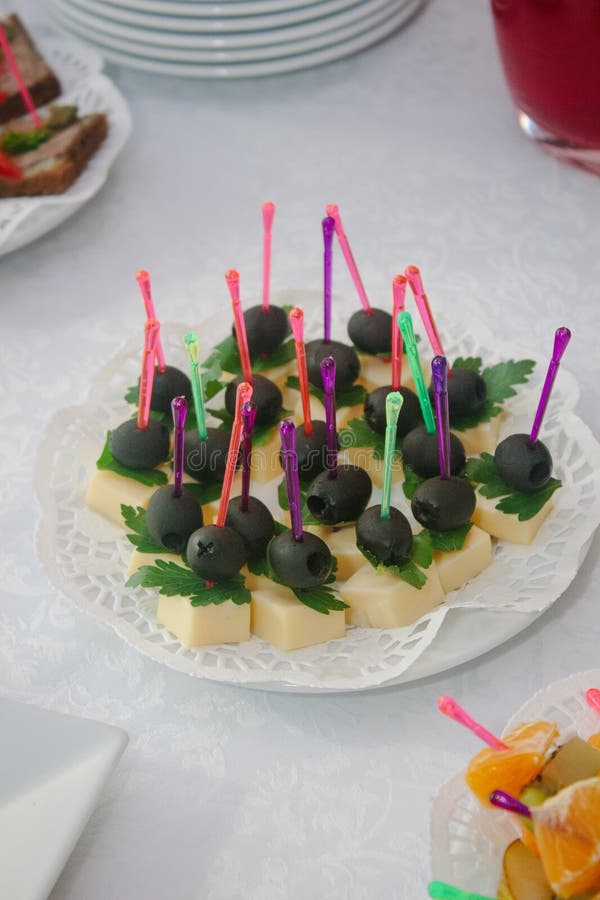Cheese and olive canapes stock photo. Image of party - 99693248