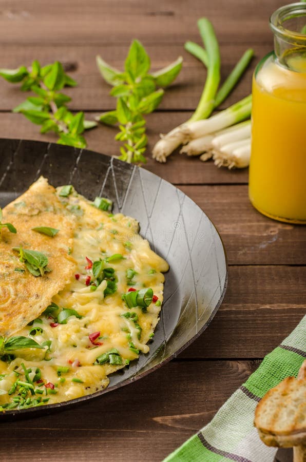 Cheese Omelet with Spring Onions, Herbs and Chilli Stock Photo - Image ...