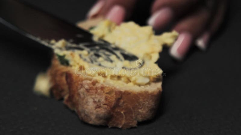 Woman Putting Cheese Paste on a Fresh Piece of Bread Stock Video ...