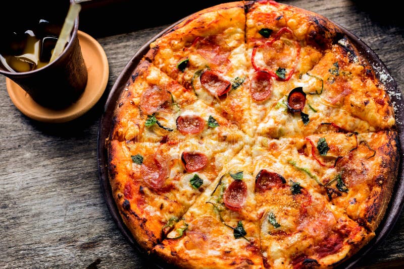 Cheese and Pepperoni Pizza with Herbs and Ice Tea Stock Image - Image ...