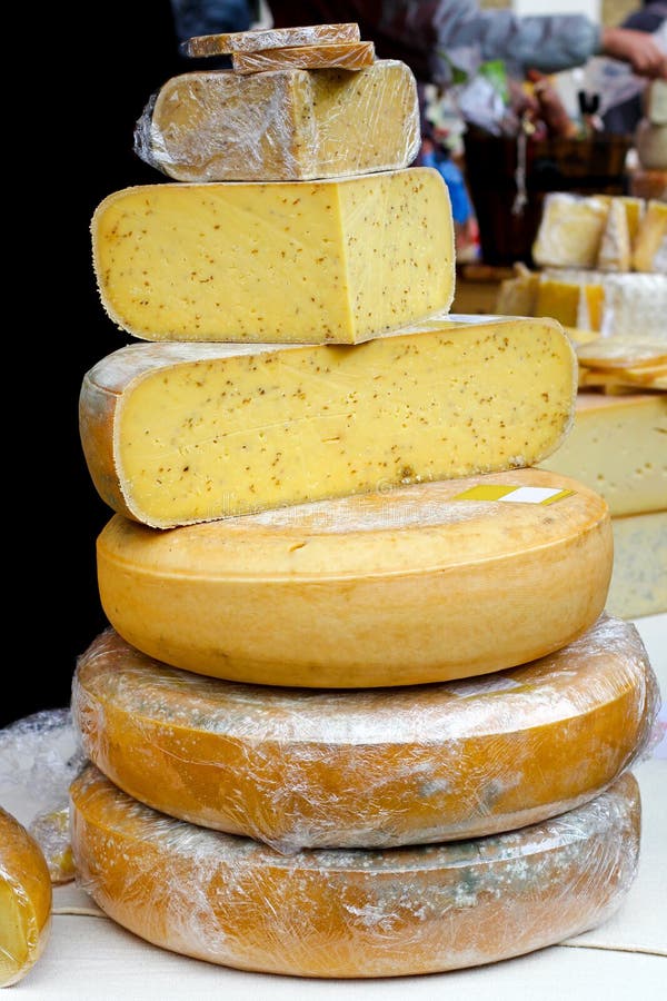 Cheese pile stock photo. Image of market, pile, wheel - 19733652