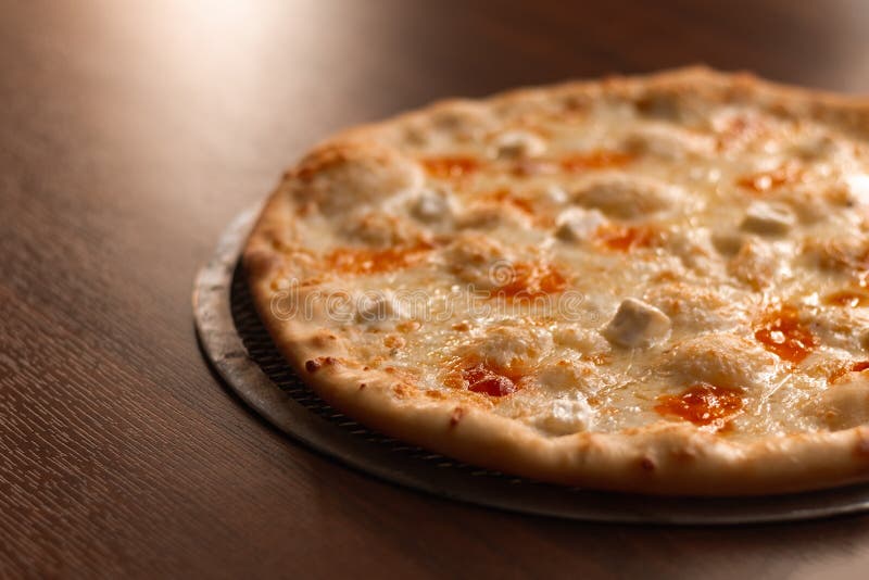 Cheese Pizza on a Baking Grid on the Table Stock Photo - Image of ...