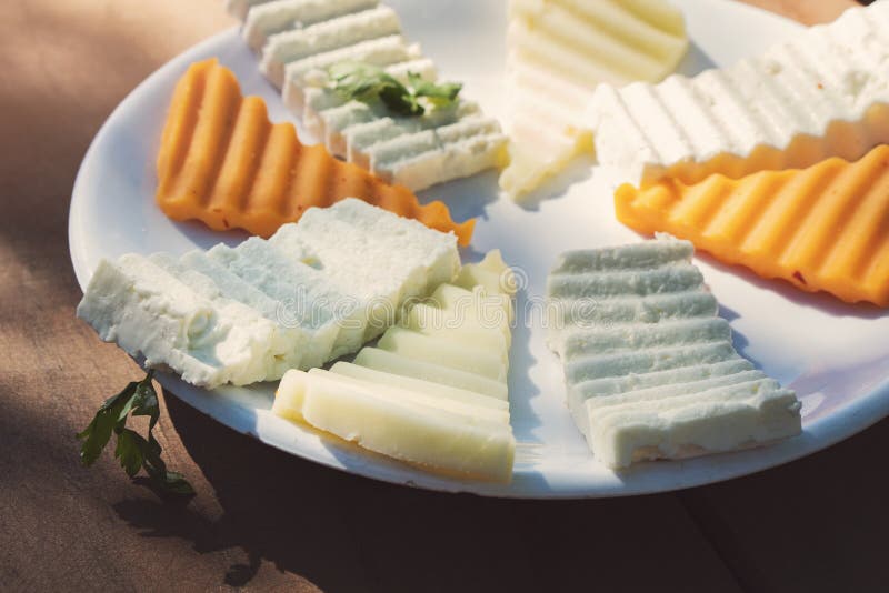 Cheese Plate with Different Colors and Flavors Stock Photo - Image of ...
