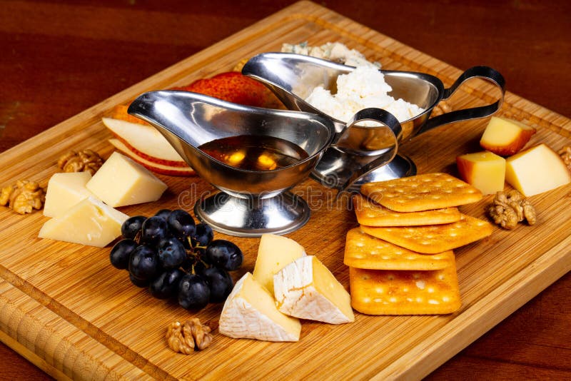 Cheese plate mix stock photo. Image of platter, gourmet - 130171656