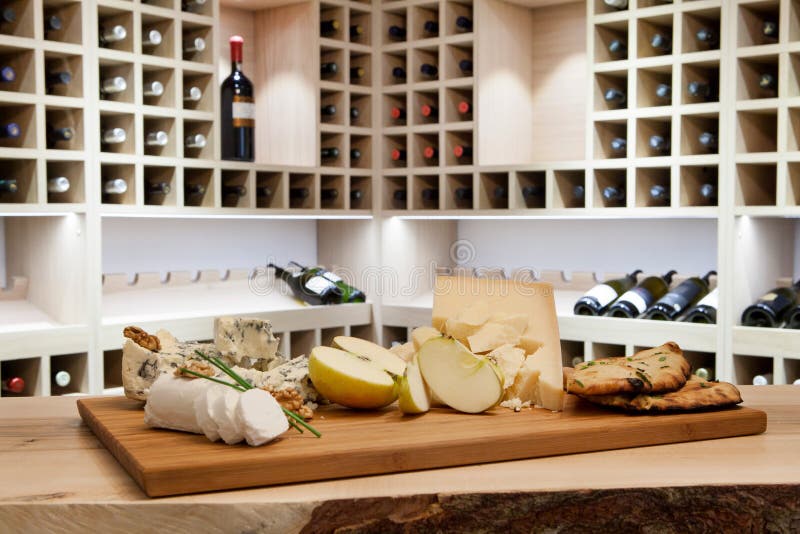 Cheese plate and wine rack stock image. Image of knife - 56113421