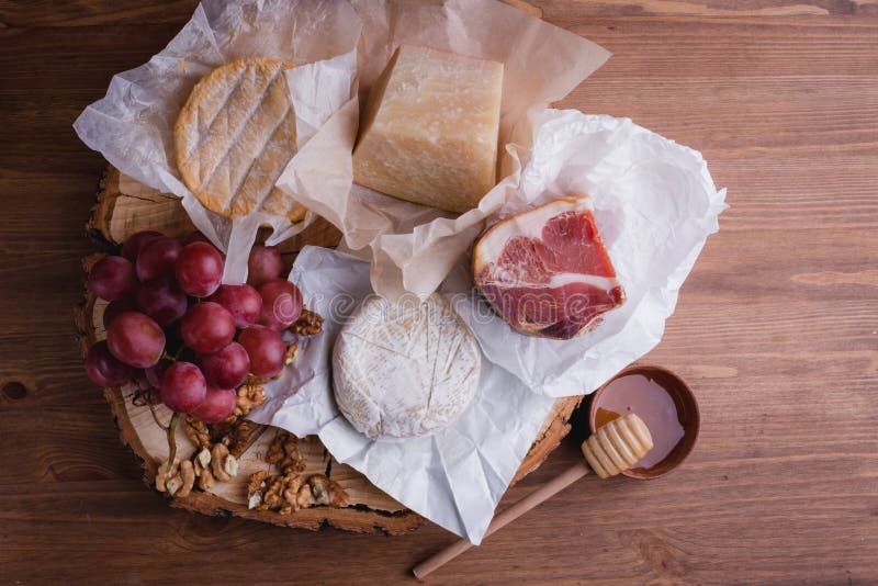 Cheese Plate on a Wooden Table. Rustic Stock Image - Image of brie ...