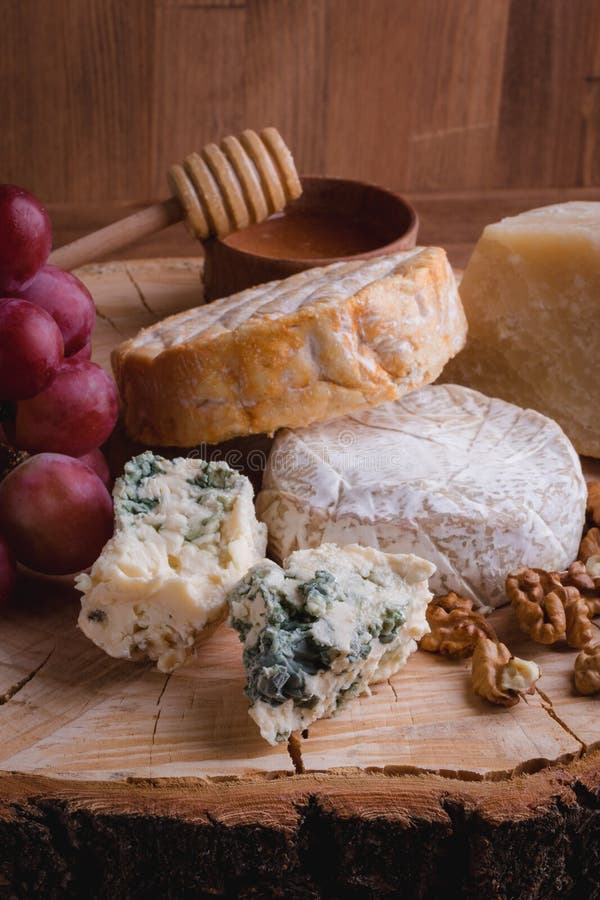 Cheese Plate on a Wooden Table. Rustic Stock Image - Image of closeup ...