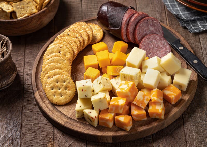 Cheese Platter with Crackers and Sausage Stock Image - Image of rustic ...