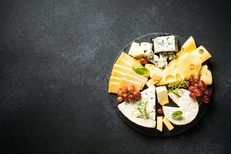 Cheese Platter with Craft Cheese Assortment at Black Background. Stock ...