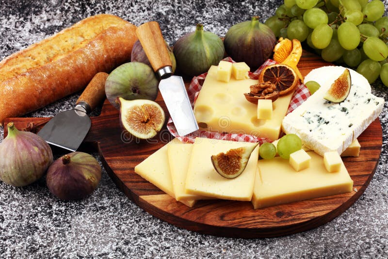 Cheese Platter with Different Cheese and Grapes and Figs and Nuts Stock ...