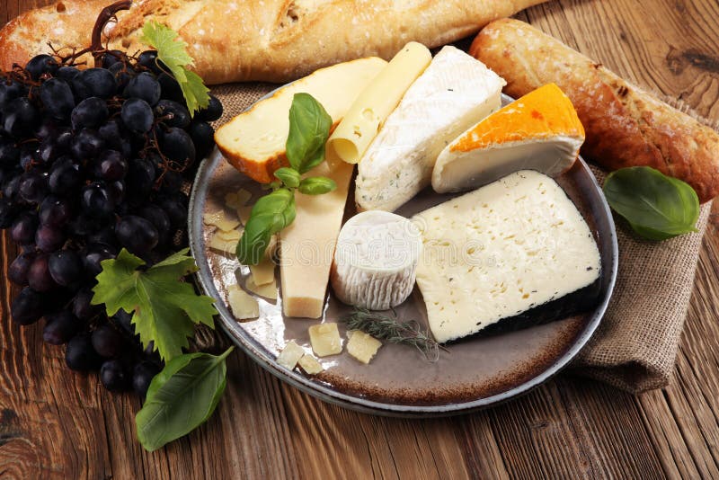 Cheese Platter with Different Cheese on Rustic Plate Stock Image ...
