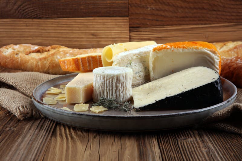 Cheese Platter with Different Cheese on Rustic Plate Stock Image ...