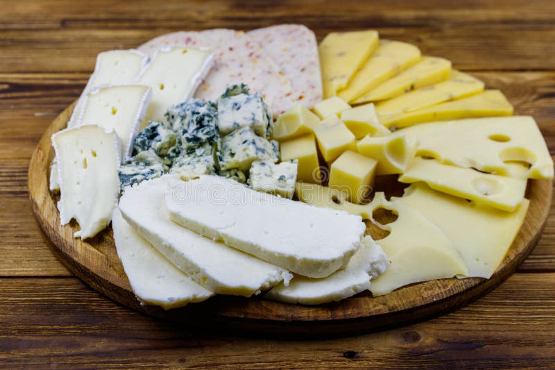 Cheese Platter with Different Kinds of Cheese on Wooden Table Stock ...
