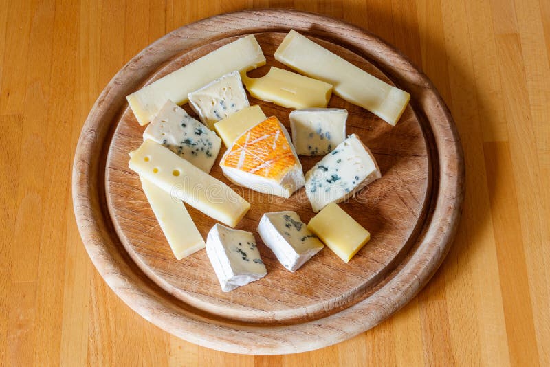 Cheese Platter with Different Kinds of Cheese on Wooden Table Stock ...